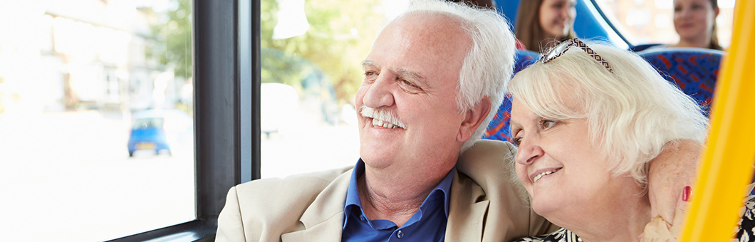 Senior Couple Enjoying Journey On Bus – AAA Exchange